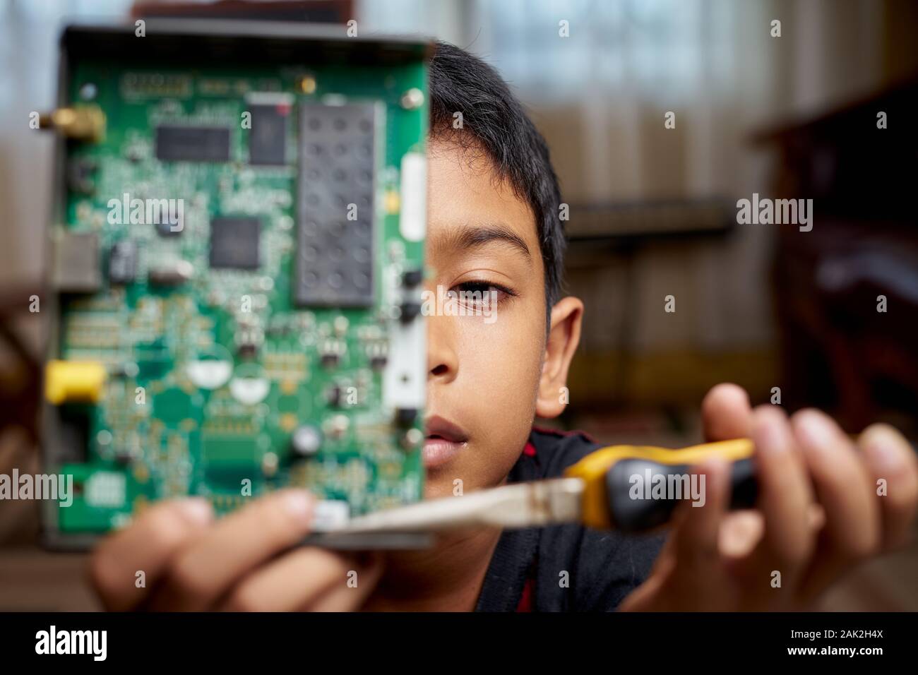 Cute Schoolboy half closed electronic circuit computer part Stock Photo ...