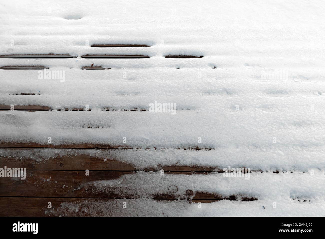 First snow on the wooden floor of the terrace Stock Photo - Alamy