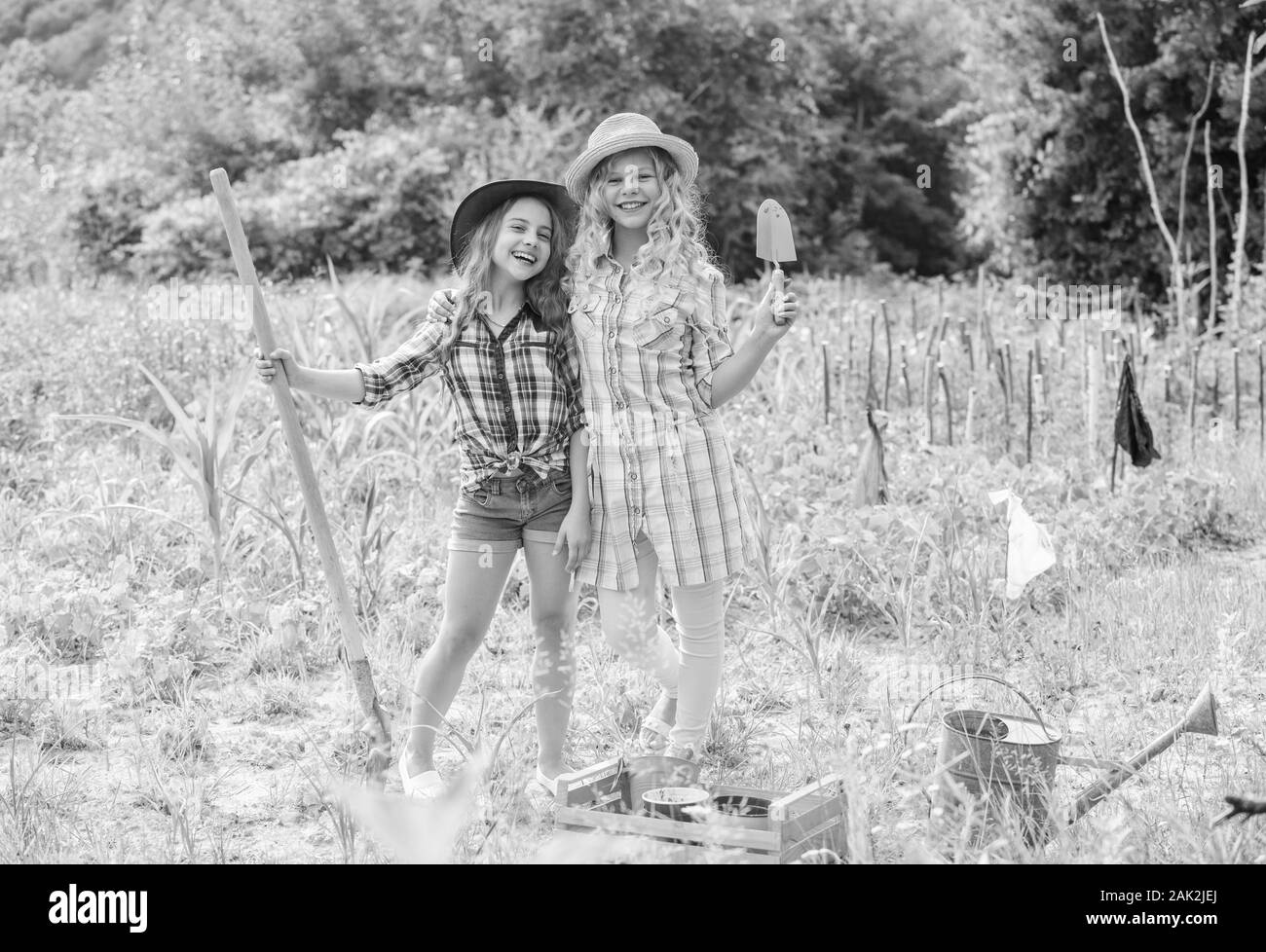 Making your life happy. children work in field use gardening tool ...