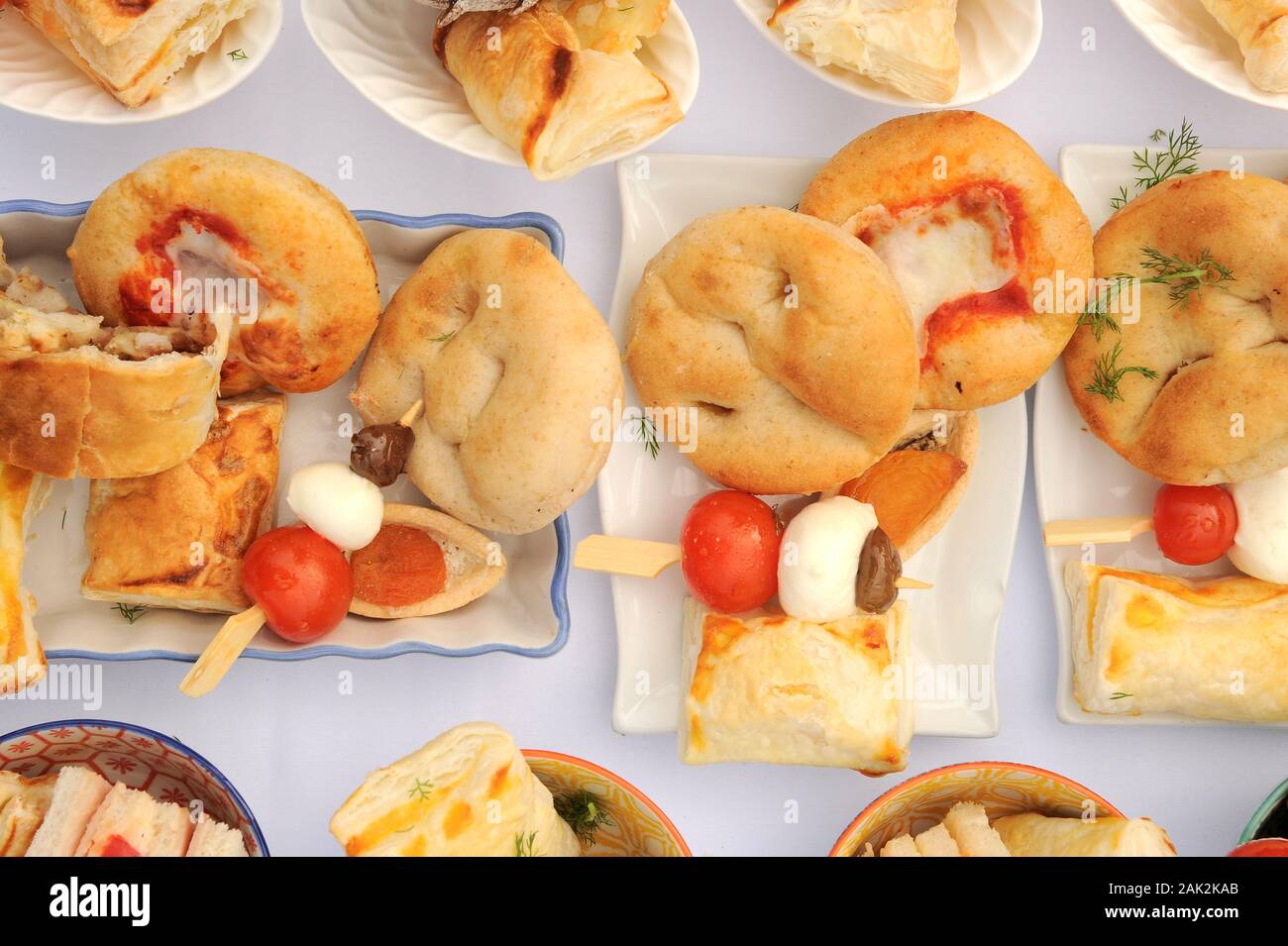 Catering : buffet of Italian pretzels , small pizzas with tomato and ...