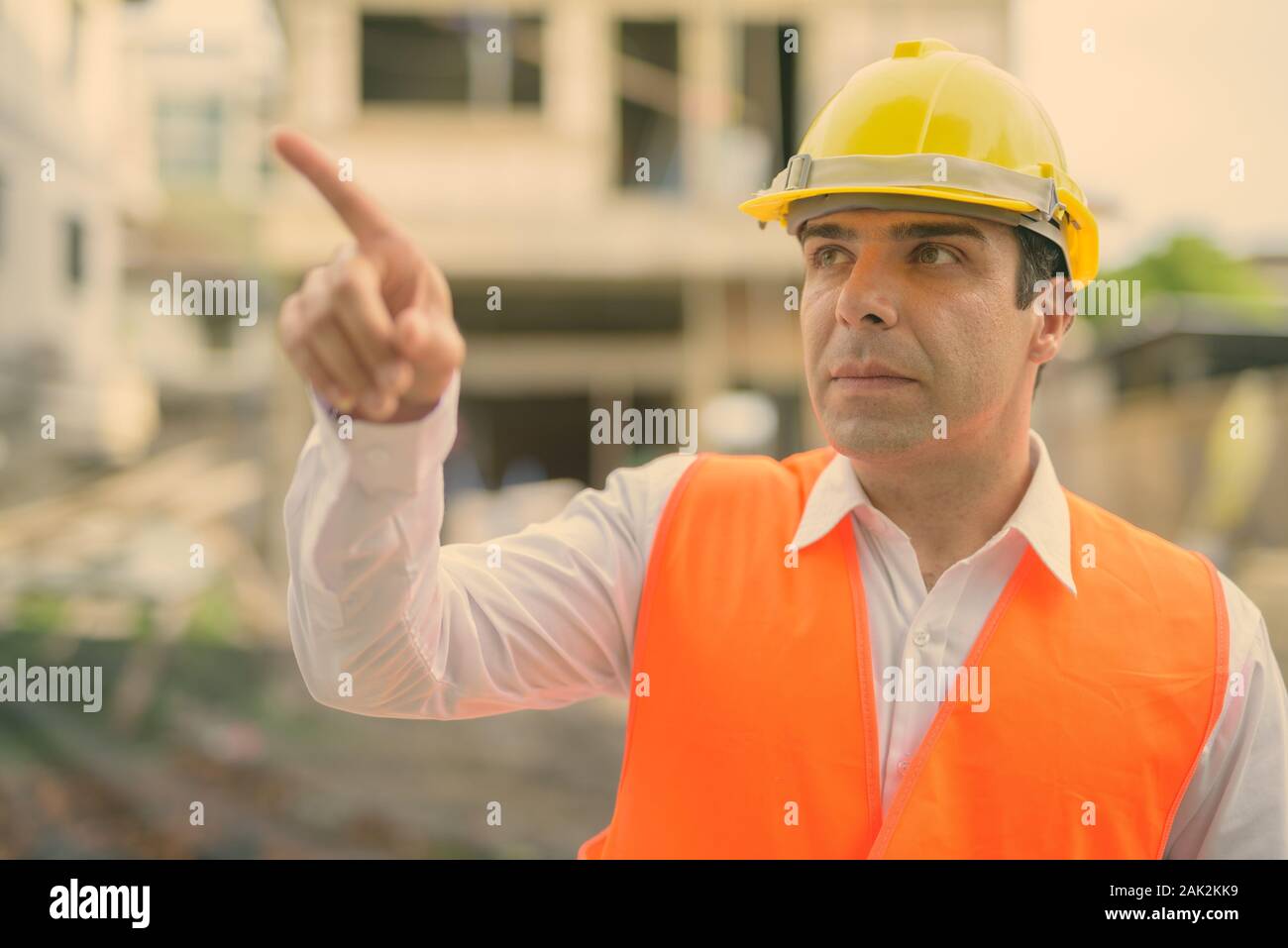 Handsome Persian man construction worker at the construction site Stock ...