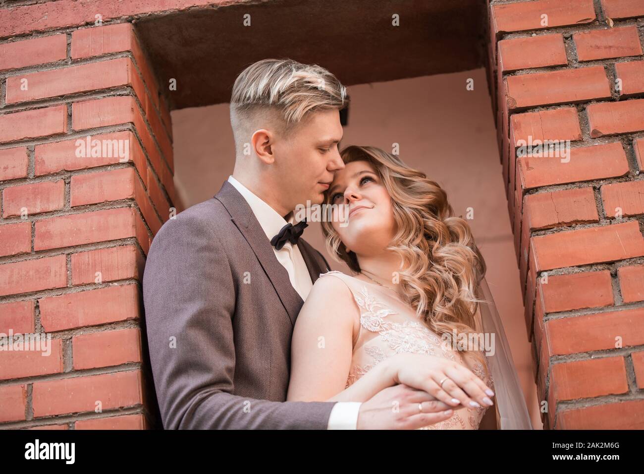 portrait of happy bride and groom standing together Stock Photo - Alamy