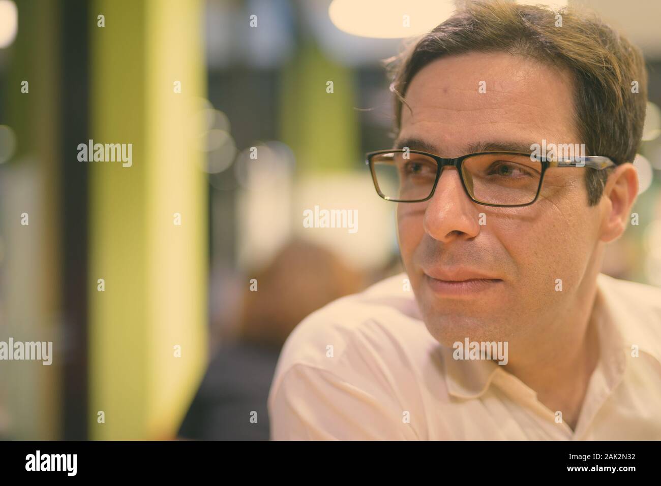 Handsome Persian businessman relaxing at the coffee shop Stock Photo ...