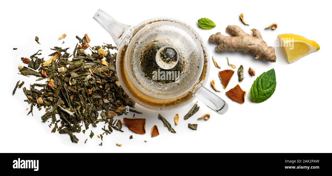 Green tea with natural aromatic additives and a teapot. Top view on ...
