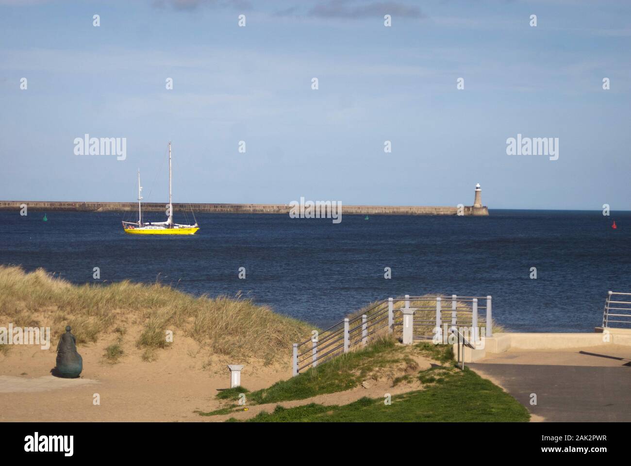 Yellow yacht off Sandhaven beach, South Shields, South Tyneside Stock ...