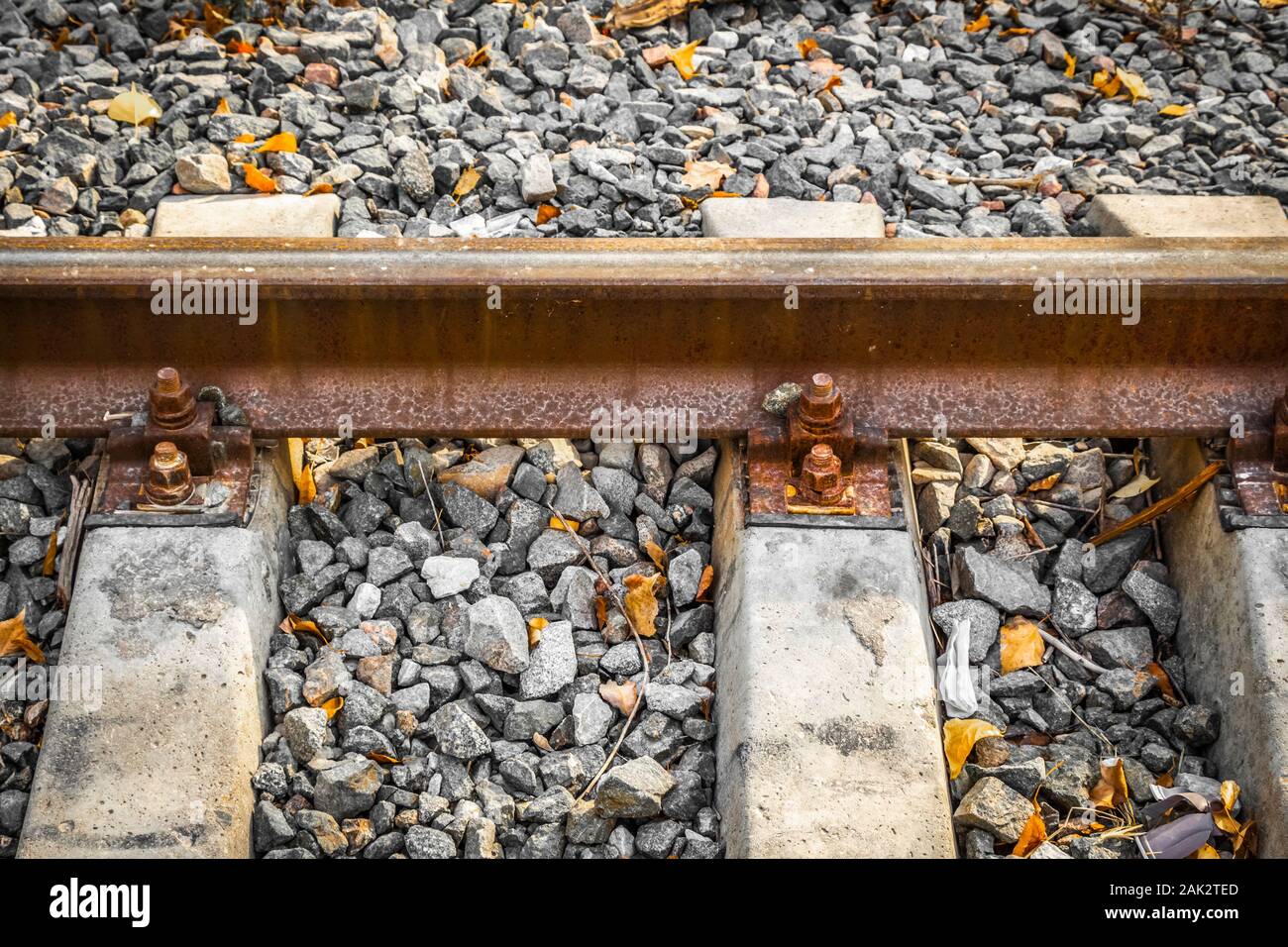 Old rusty nuts fastening a rail rail closeup Stock Photo - Alamy