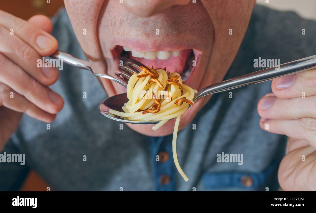 Man Eating Spaghetti With Worms Stock Photo Alamy man-eating-spaghetti-with-worms-stock-photo-alamy