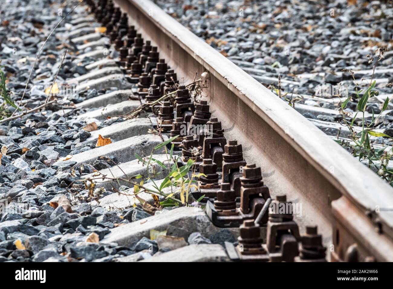 Old rusty nuts fastening a rail rail closeup Stock Photo - Alamy