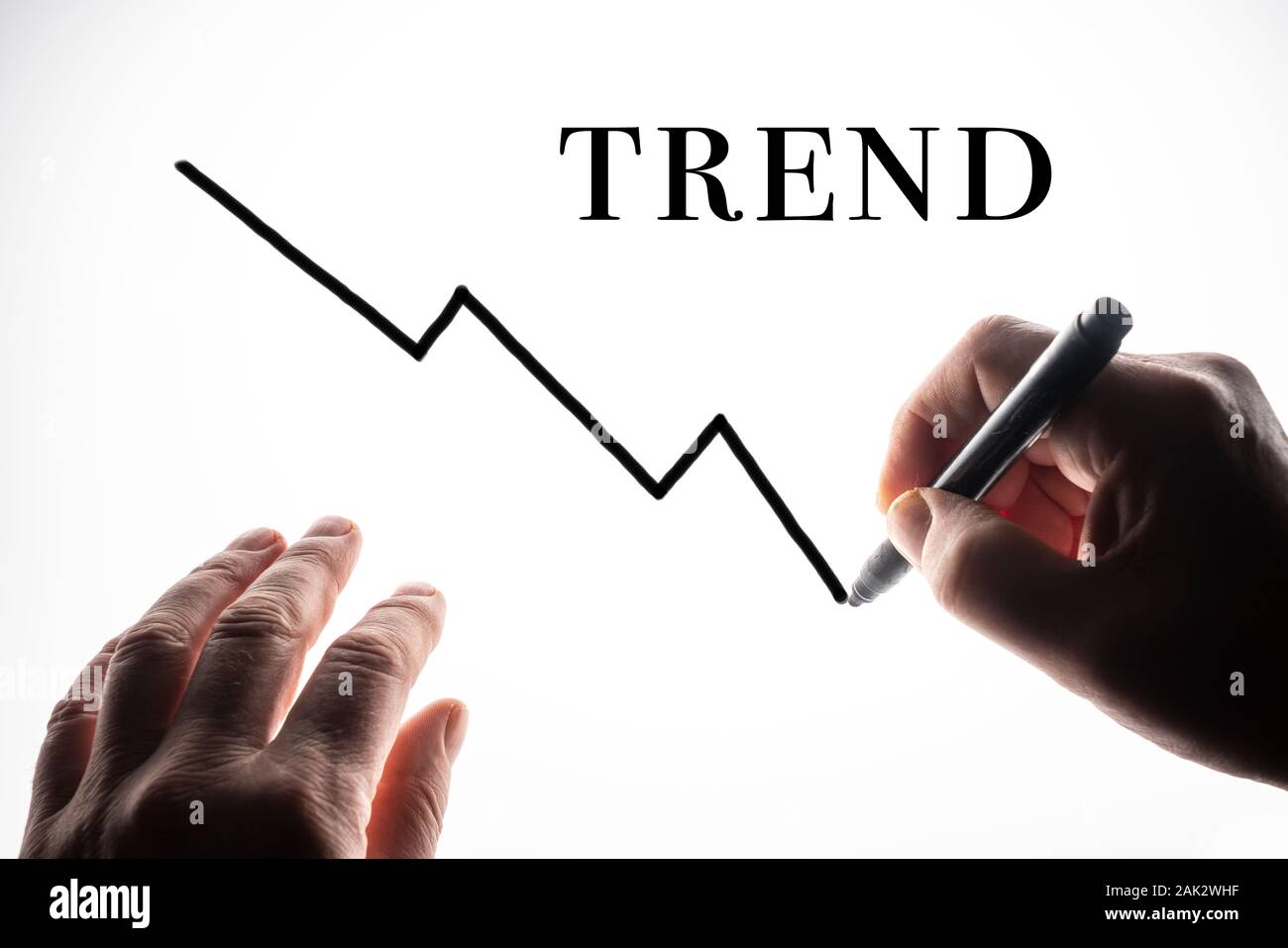 the trend graph drawn on a backlit surface Stock Photo - Alamy