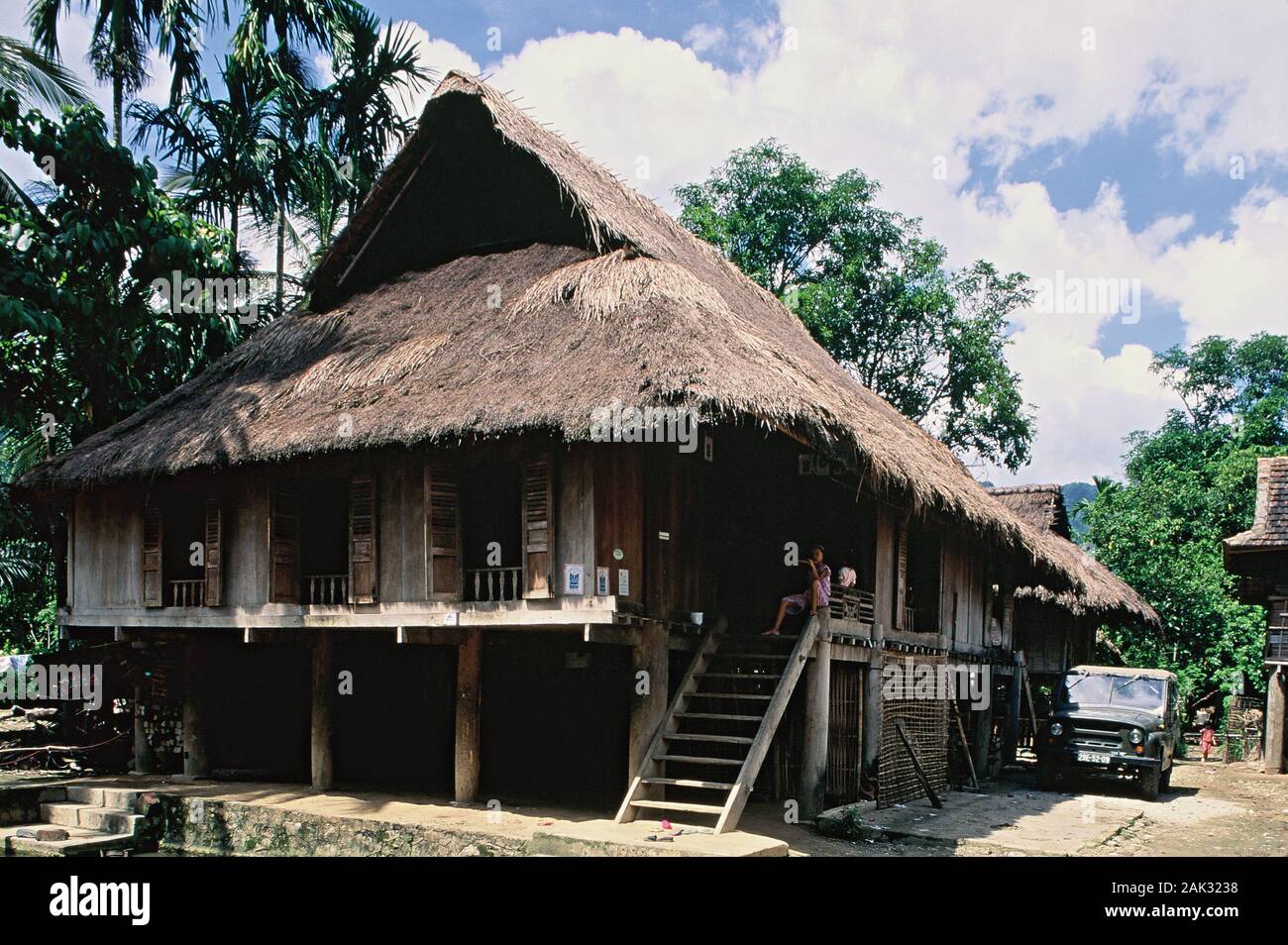 A house with a thatched roof standing on piles in Maichau in the north ...