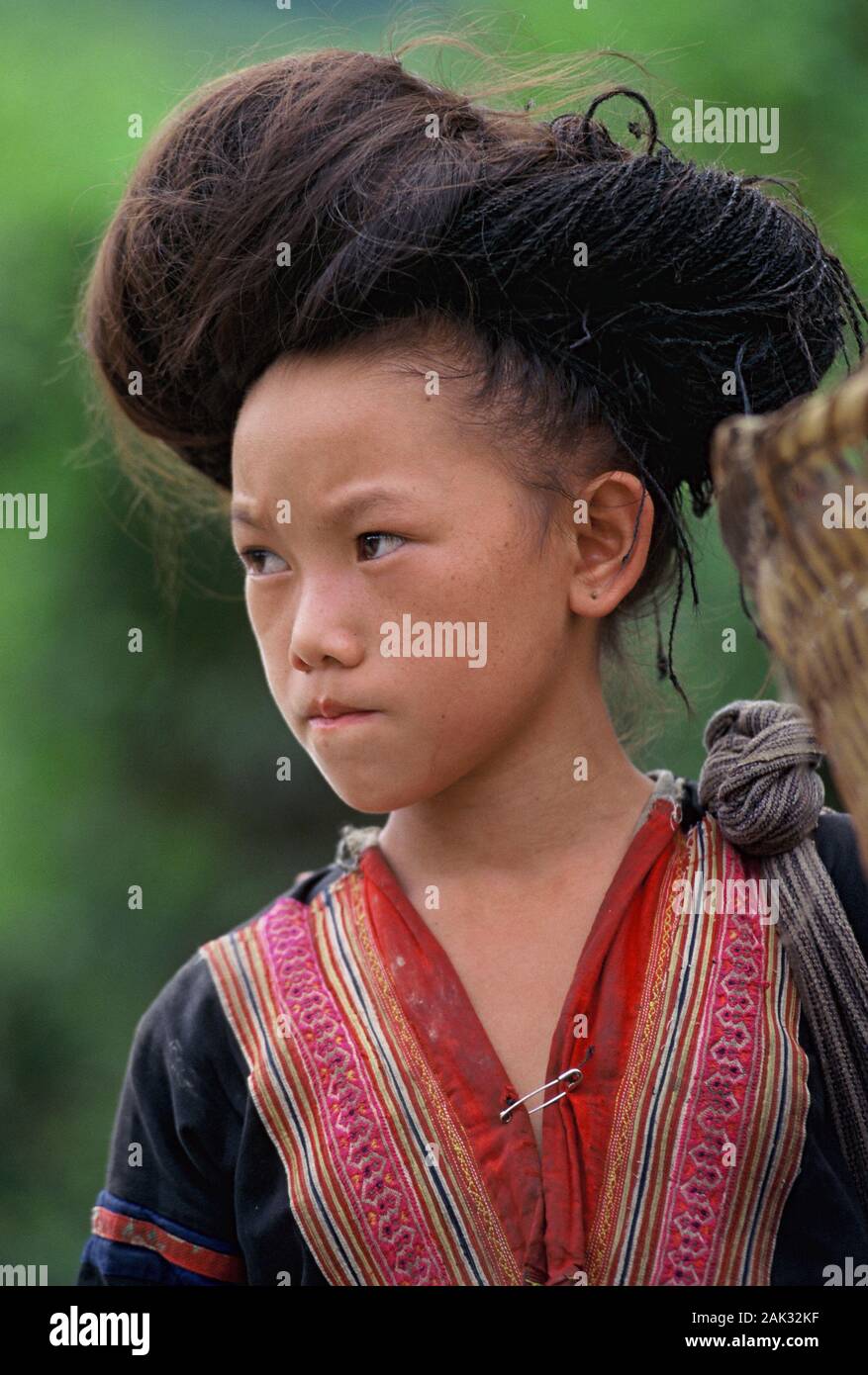 A girl of the Meo people in the north of Vietnam wearing her hair in ...