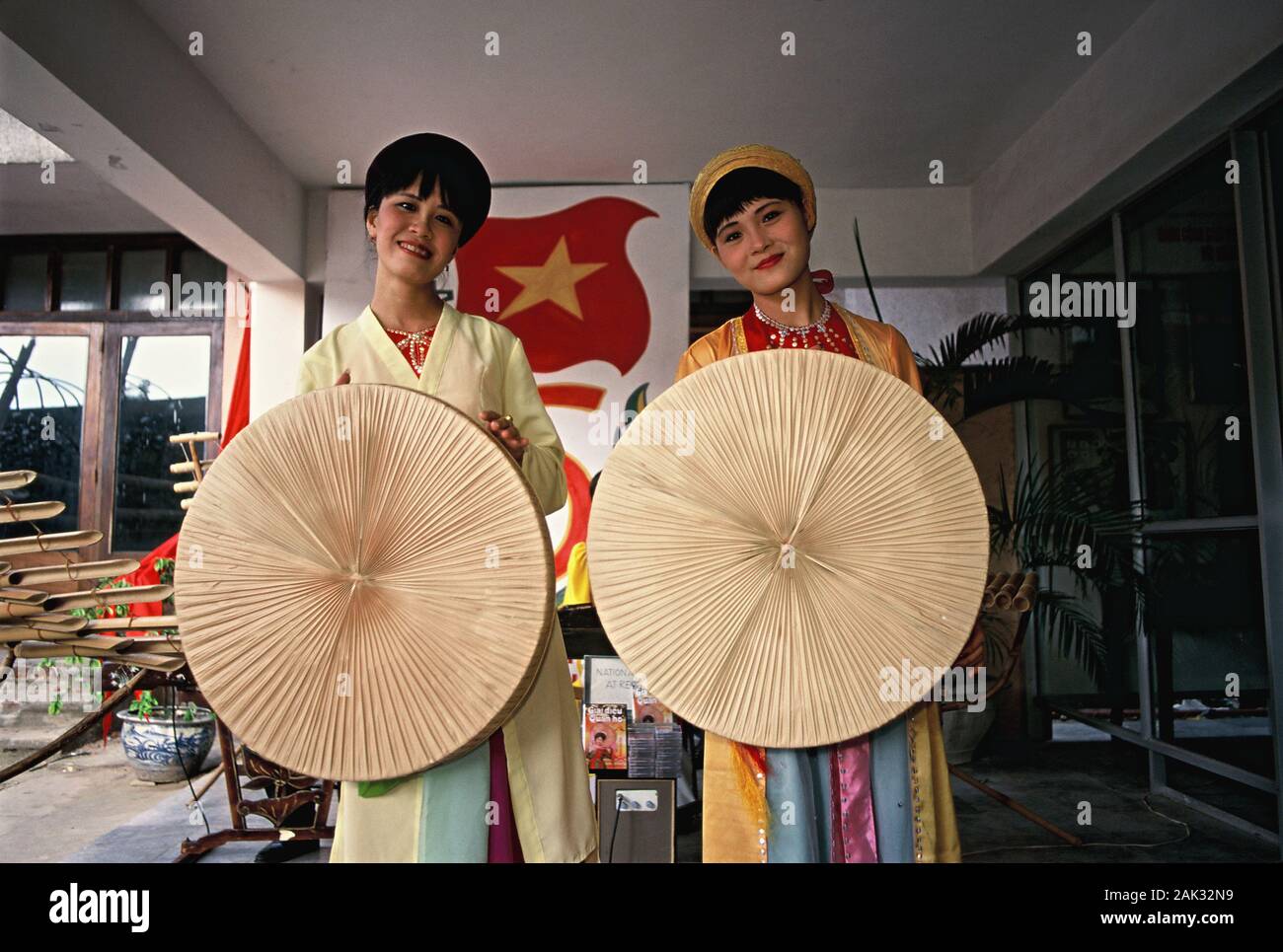 Twi Vietnamese women presenting traditional musical instruments in the ...