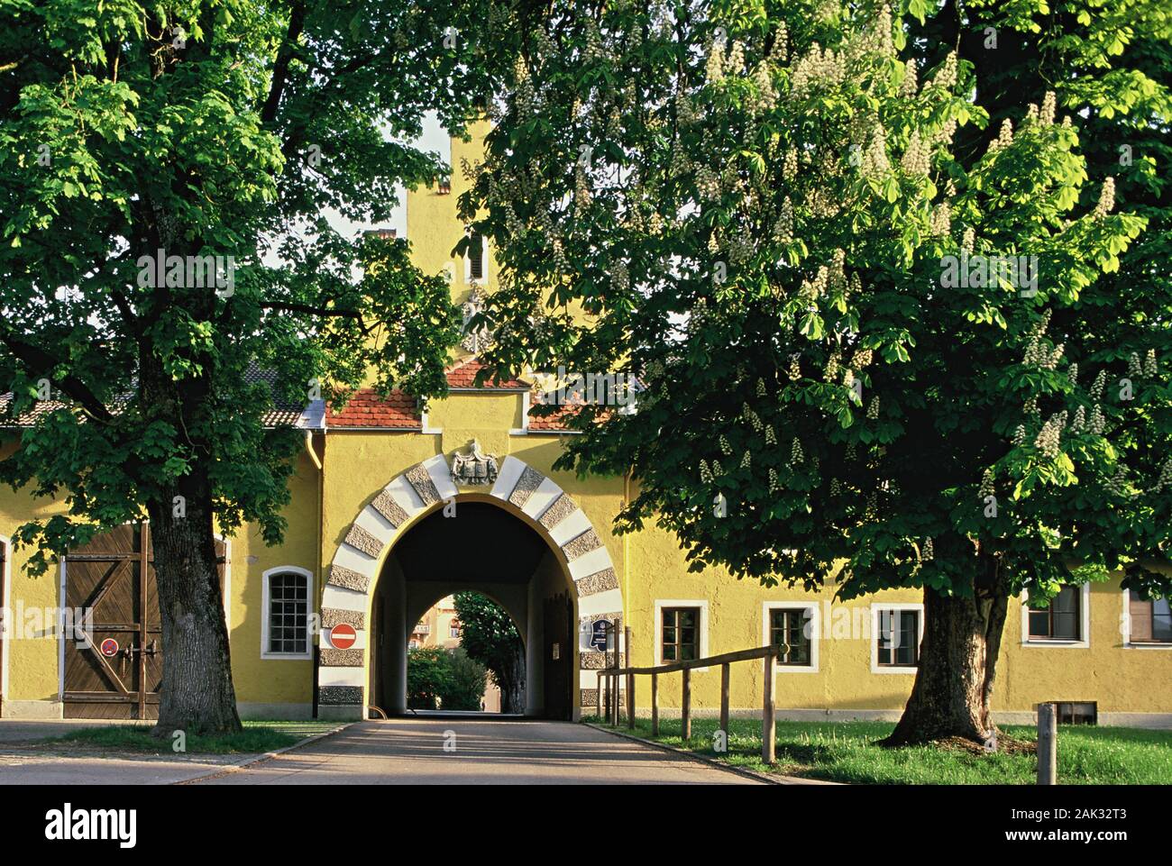 A grand gate marks the entrance to the Hochschloss Castle in Stein an ...