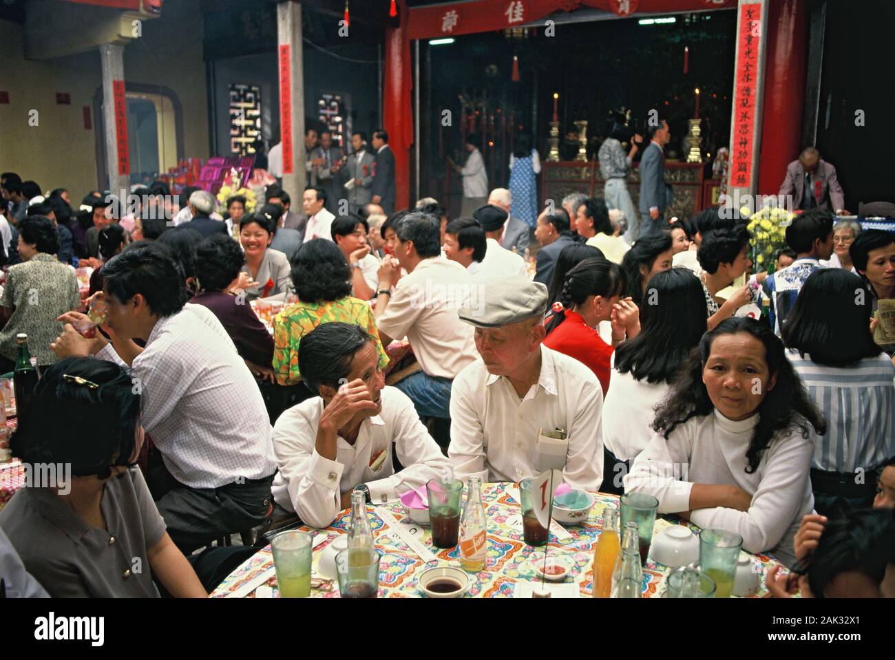 Many people taking part in a family celebration in the Chinese ...