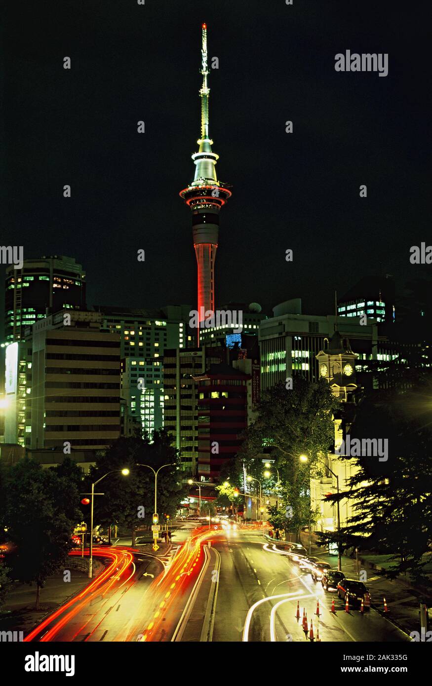 The lighted Sky Tower dominates the nightly skyline of Auckland, the ...
