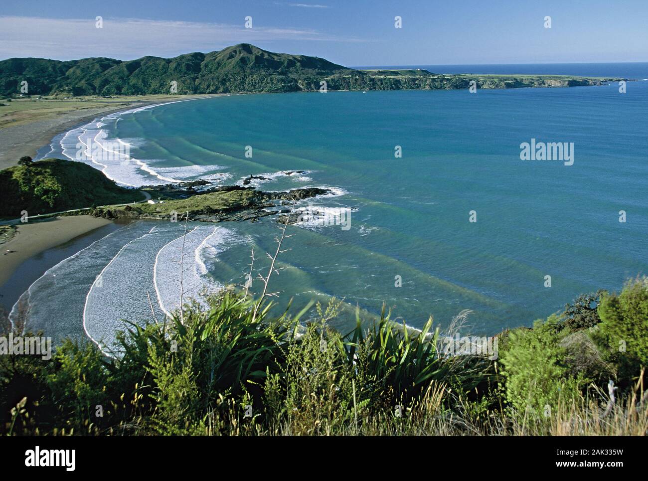Craggy rocks separate a bay at the East Cape in the east of the North ...