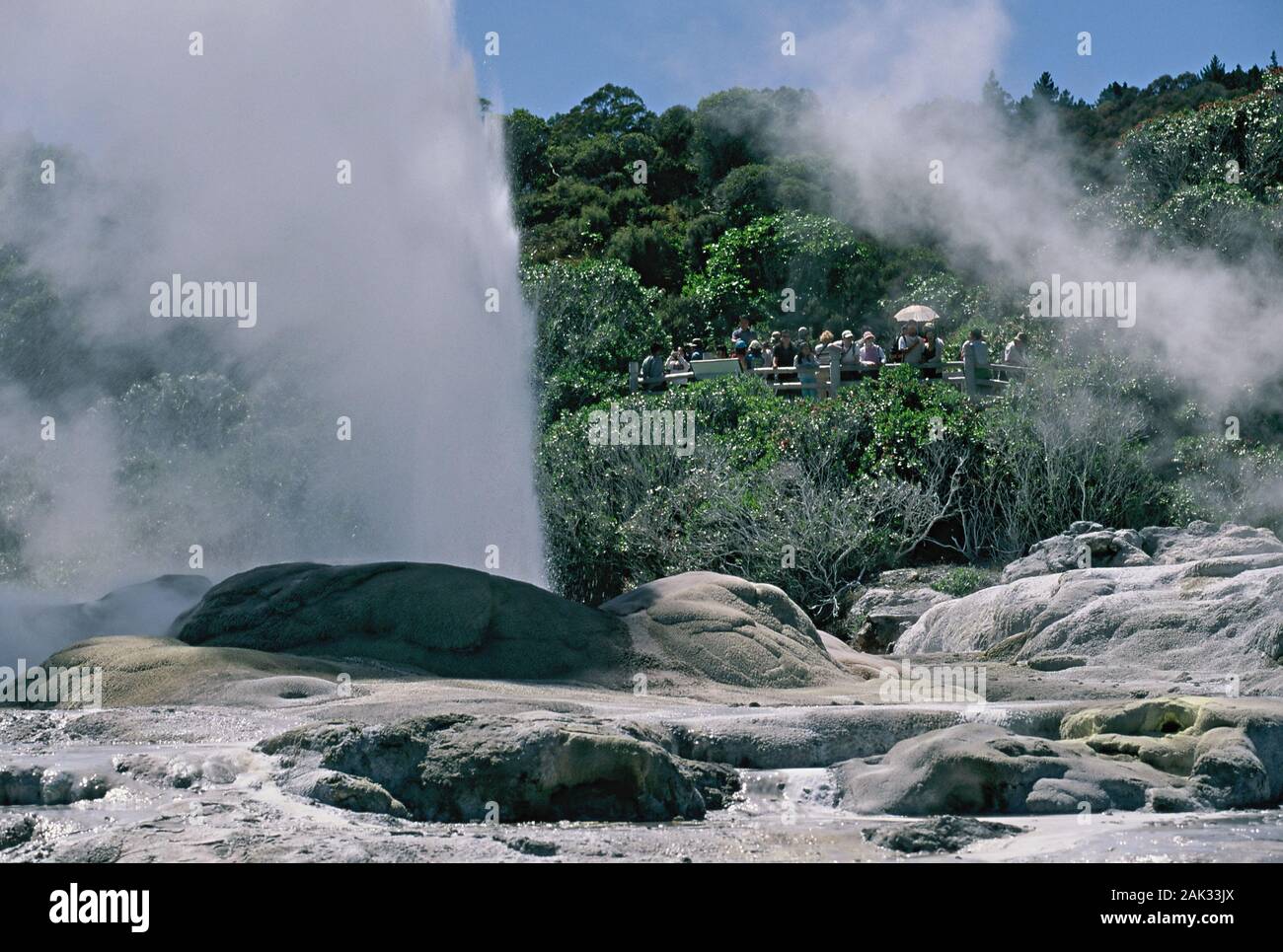 The water fountain of a geyser rockets high to the sky in the ...