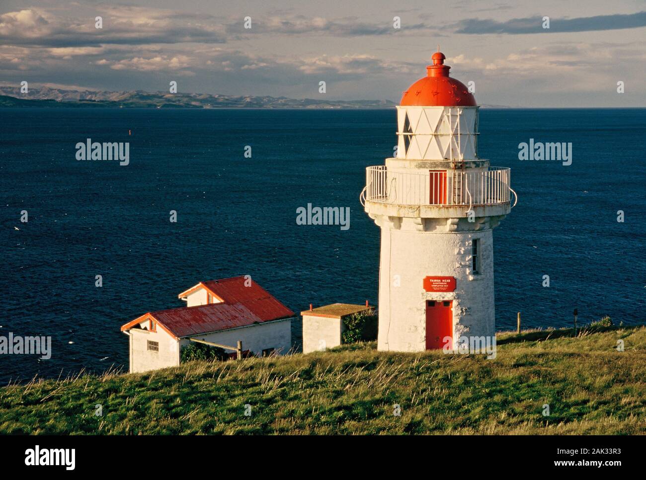 A lighthouse is situated at the Taiaroa Head at the northern headland ...