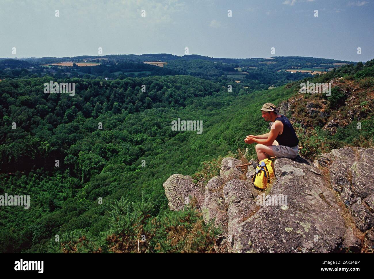 A hiker enjoys the view from a mountainin the Orne valley in Normandy ...