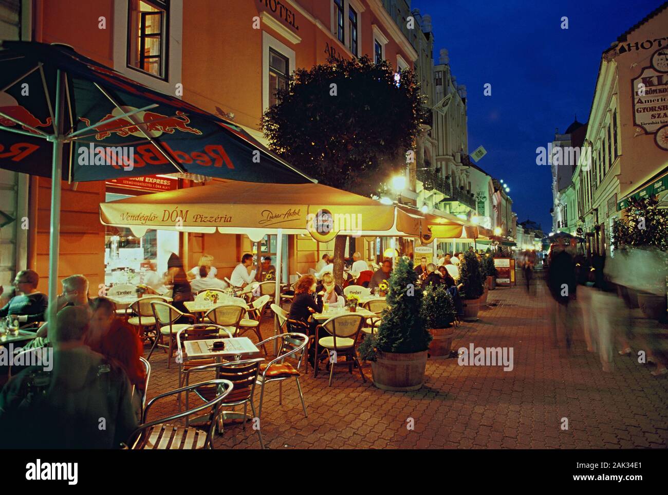 People sit outside in the restaurants in Pecs, Hungary. (Undated ...