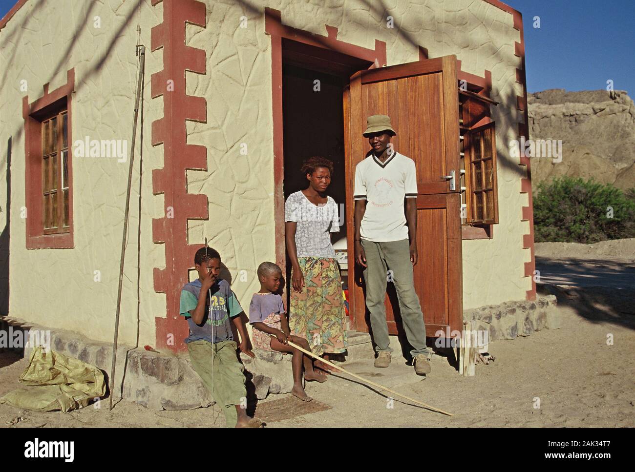 Nama farmers in front of their house in the river oasis Goanikontes ...
