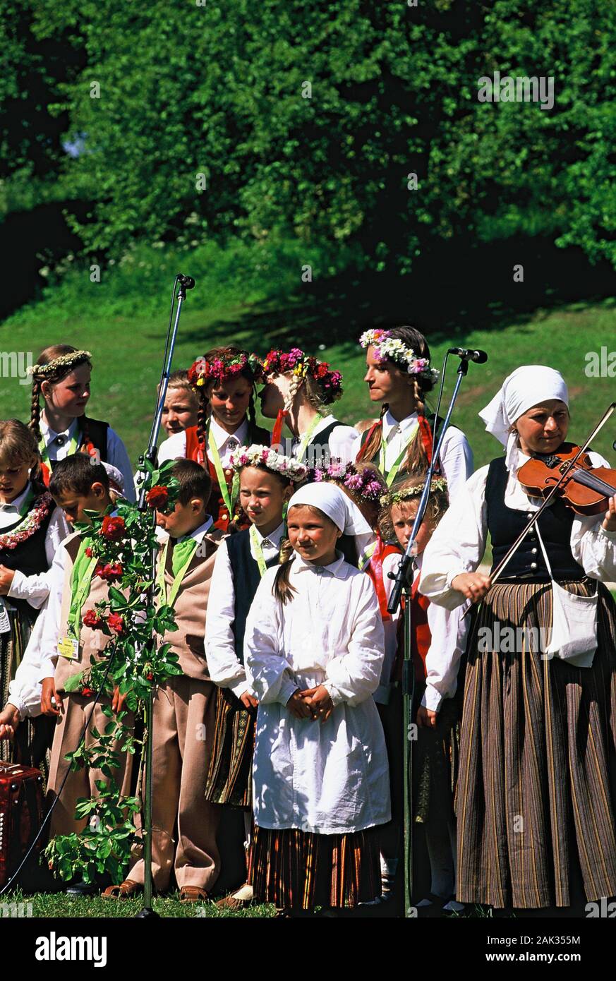 The picture shows people in costumes at a folklore-festival in the ...