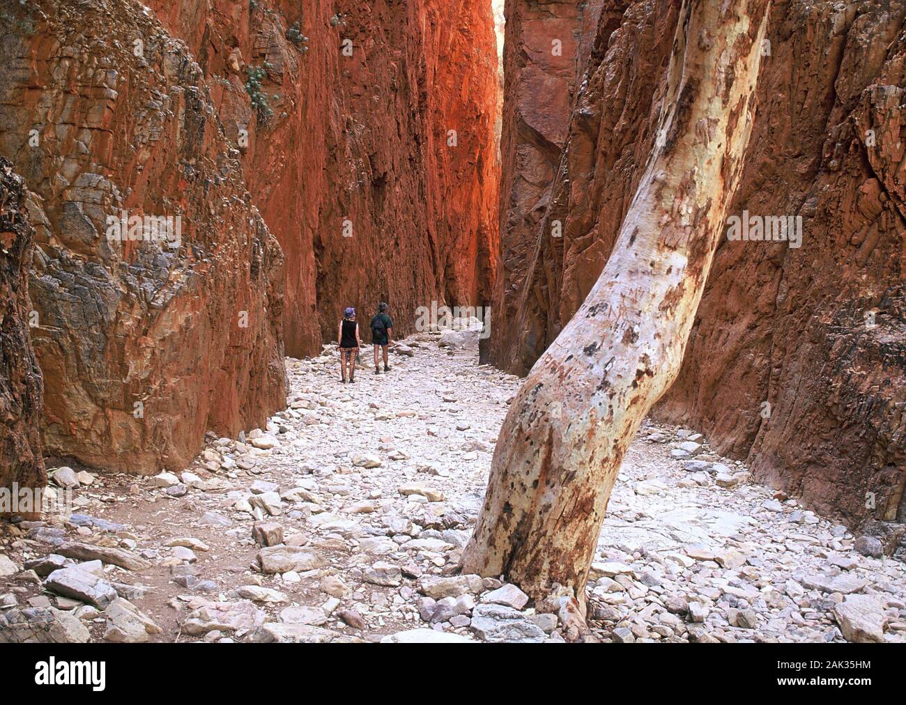 People walk through the Standley Chasm located in the MacDonnell Ranges ...