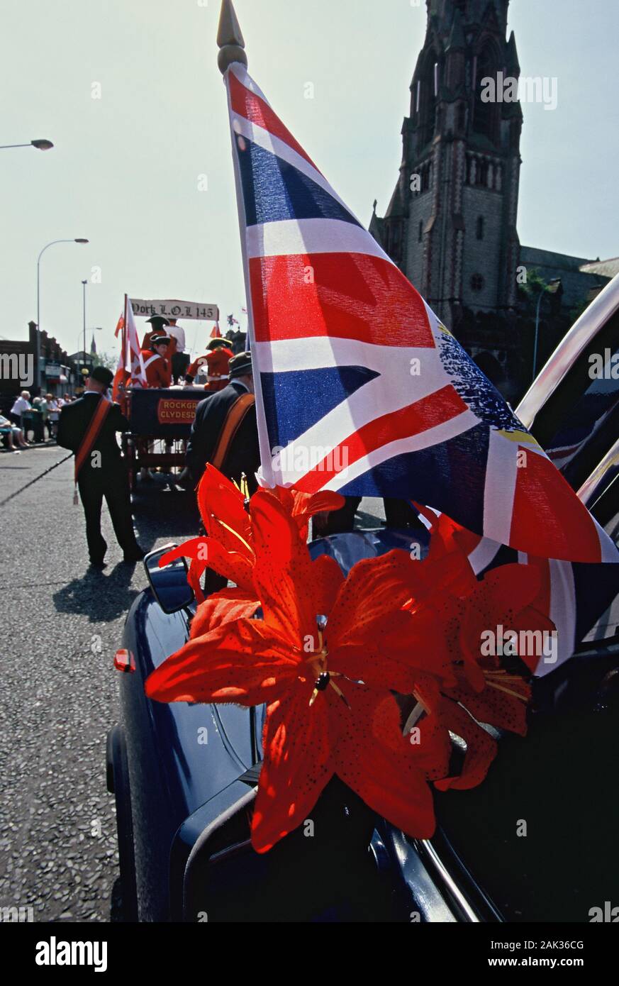 During the Battle of Boyne Day protestants walking with British flags ...