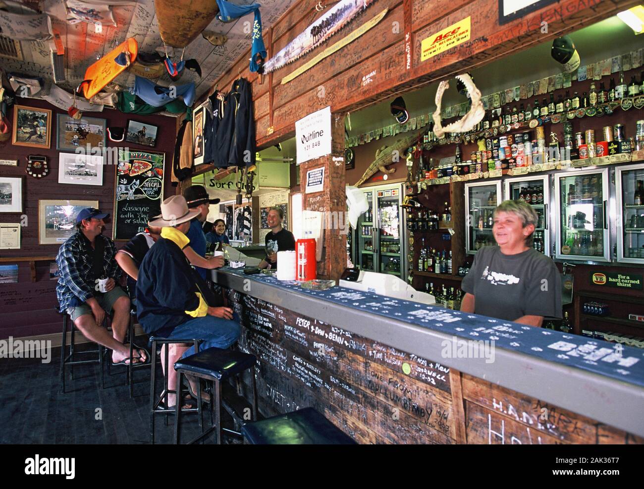 People are sitting in the pub of the Blue Heeler Hotel in Kynuna in ...