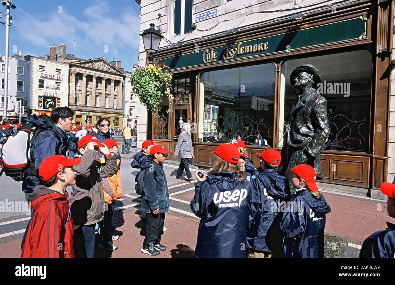 A group of pupils standing in front of the sculpture of the famous ...