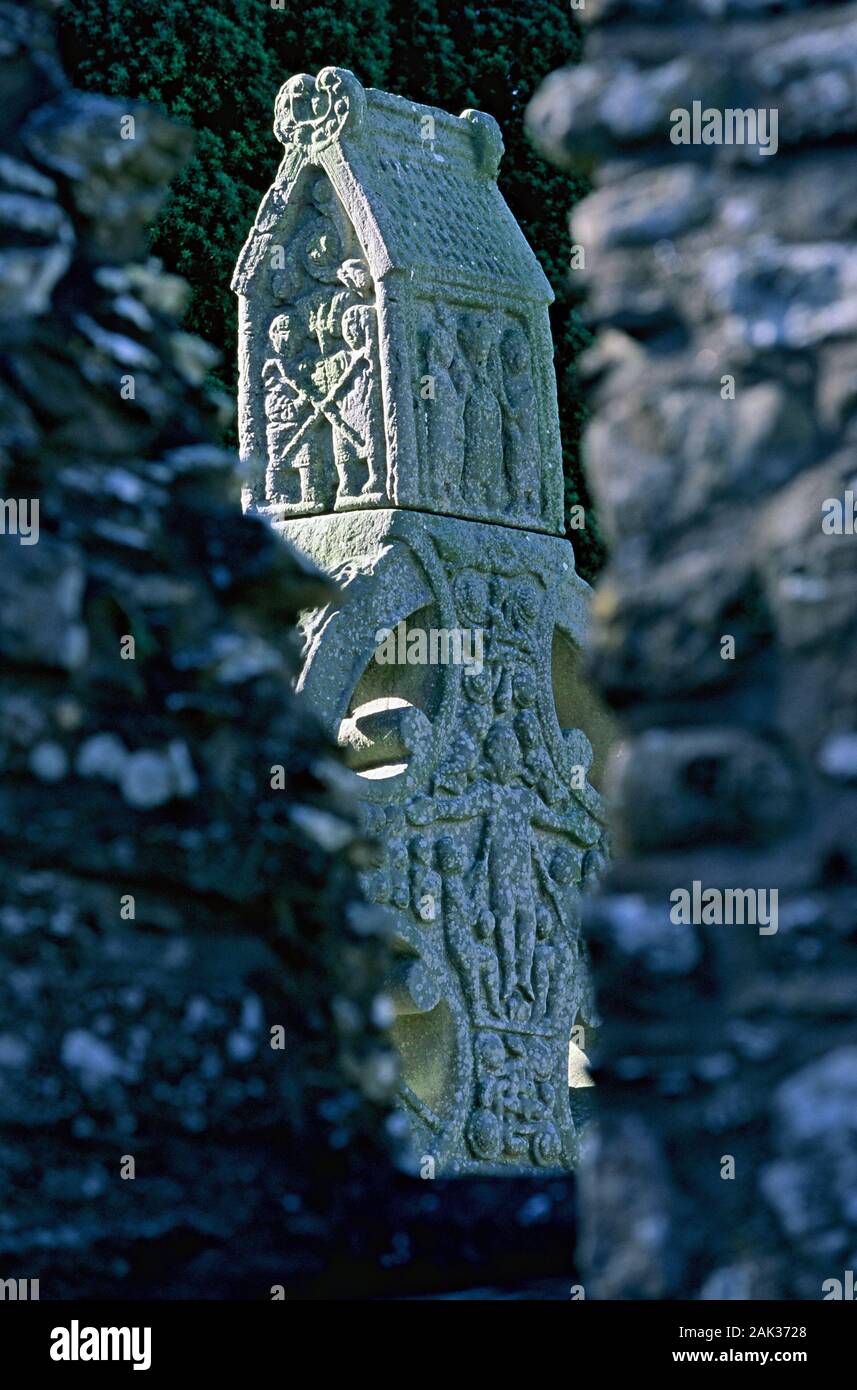 One of three celtic crosses made from sandstone stands on the cemetery ...