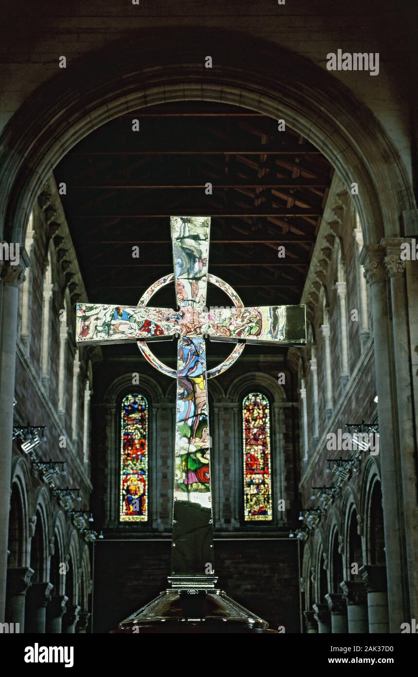 A colorful created cross hangs in the neo Romanesque Belfast Cathedral ...