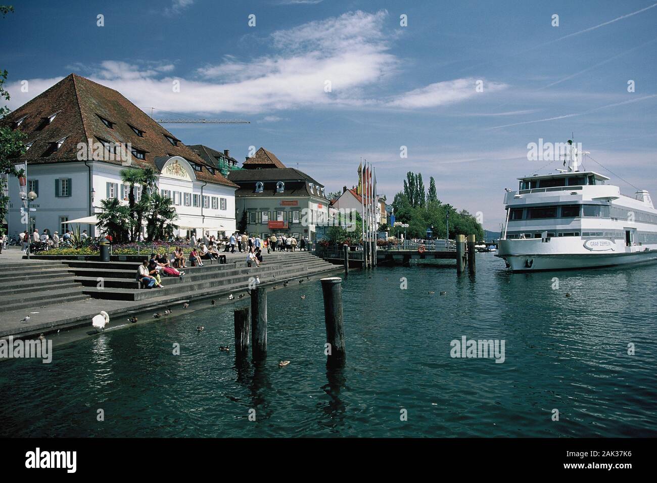 A ferry landing at the landing stage in Ueberlingen. Ferries are an ...