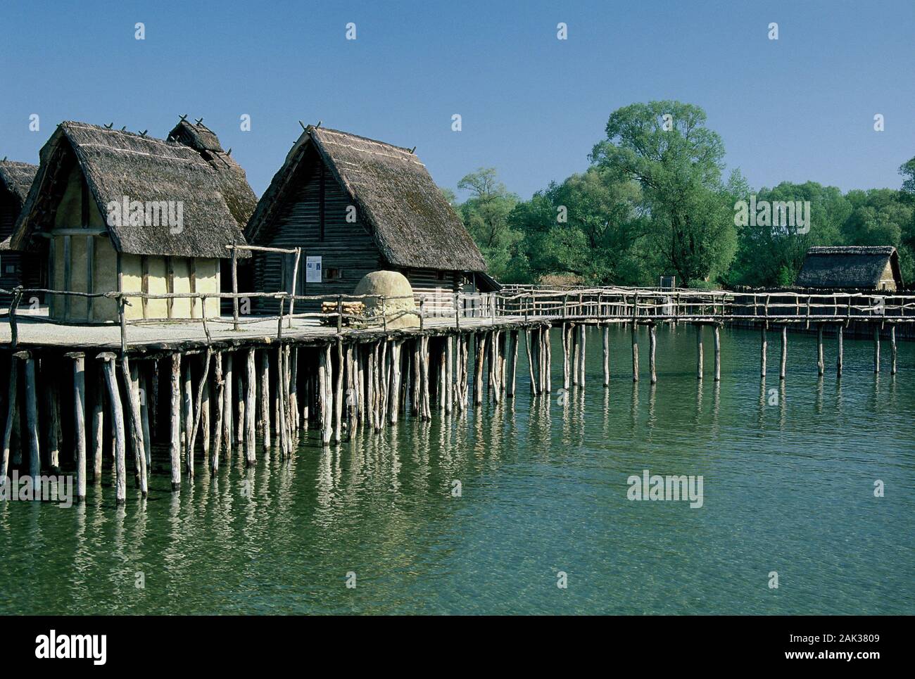 Reconstructions of stilt houses of the stone and bronze age stand in ...