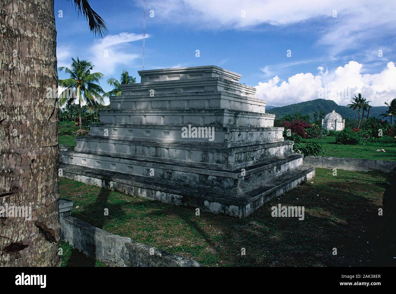 The mausoleum of a Samoan king stands beside several other royal tombs ...