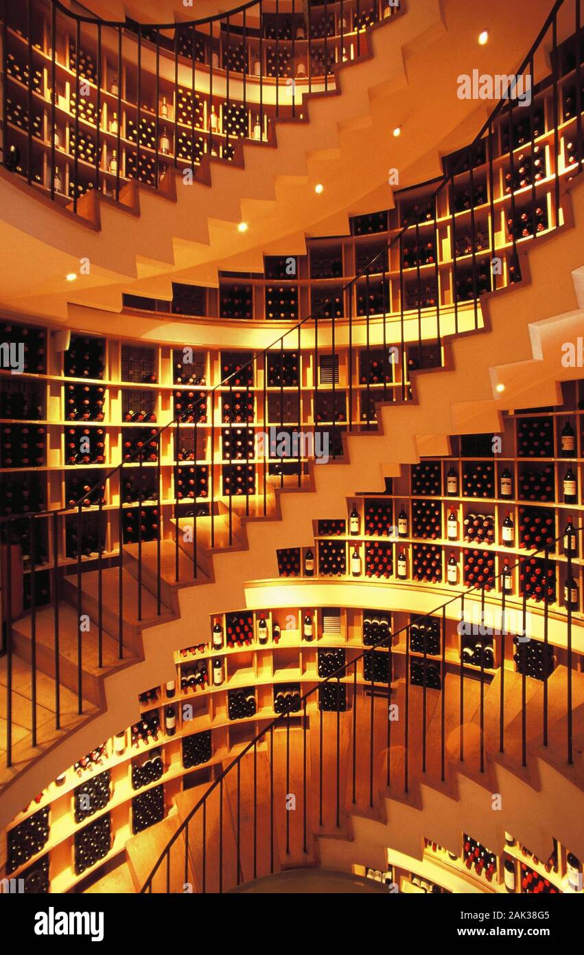 View of the illuminated stairway of the wine shop L' Intendant in ...