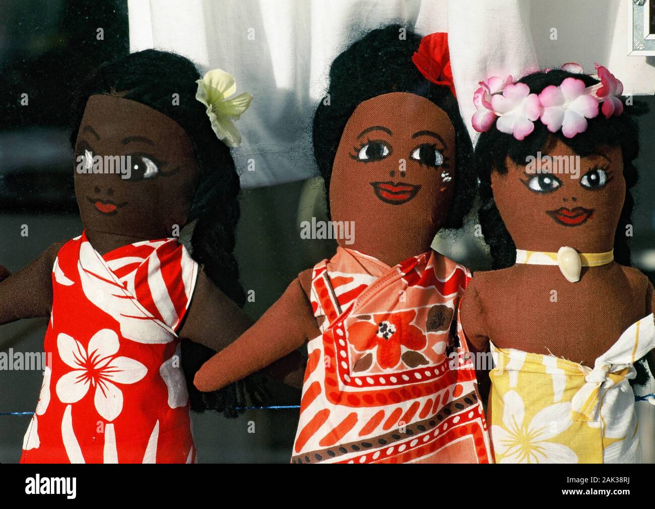 Hand-made dolls in the style of the women of the Cookislands are a ...