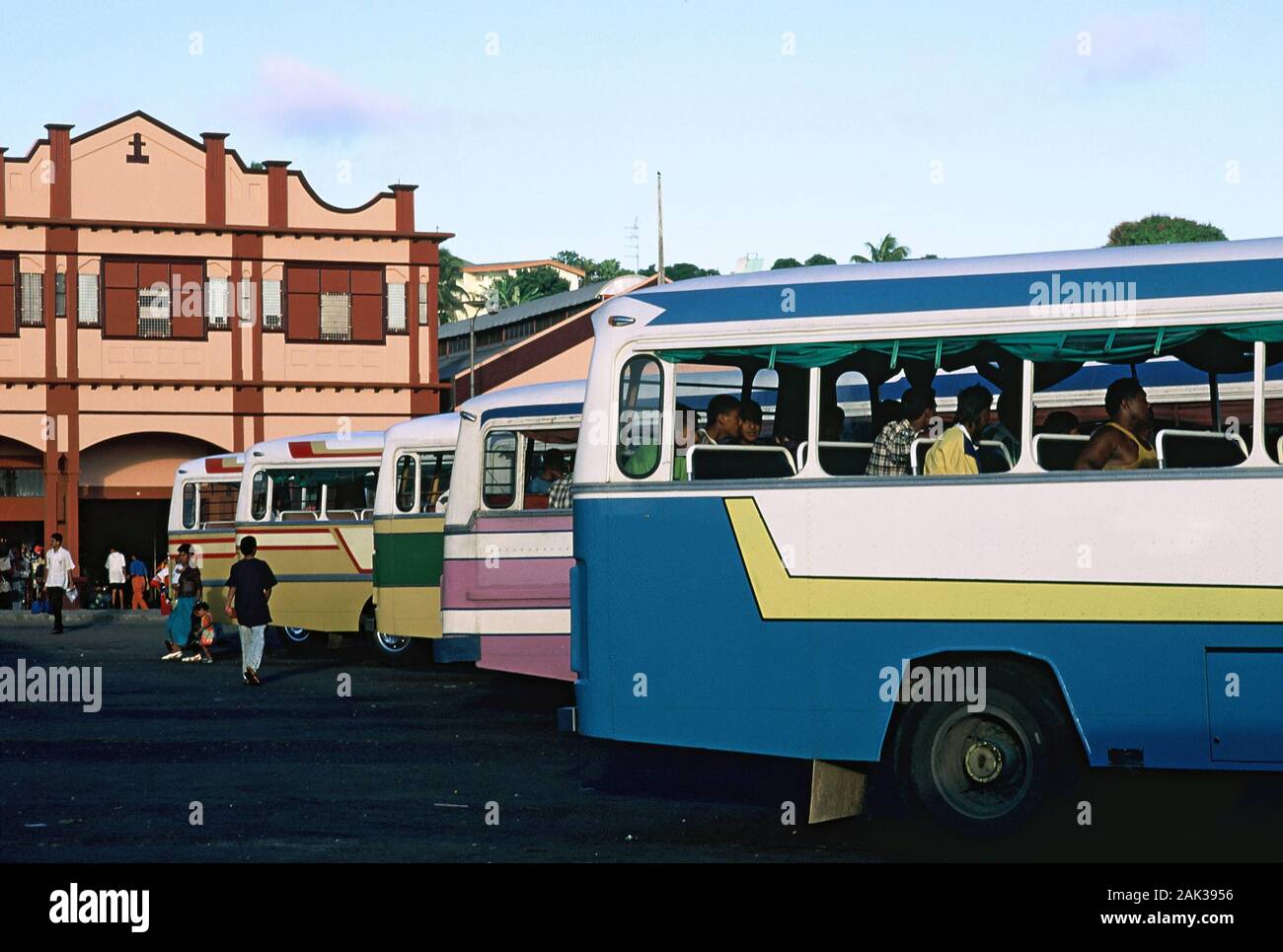 Several busses stand at the bus station of Suva. Suva is the capital of ...