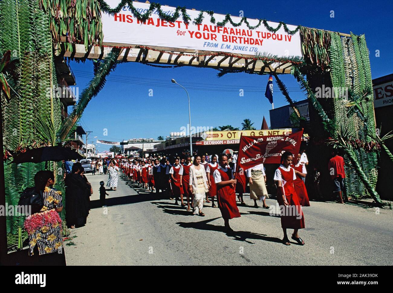 Pupils presenting a parade on the occasion of the birthday of the king ...