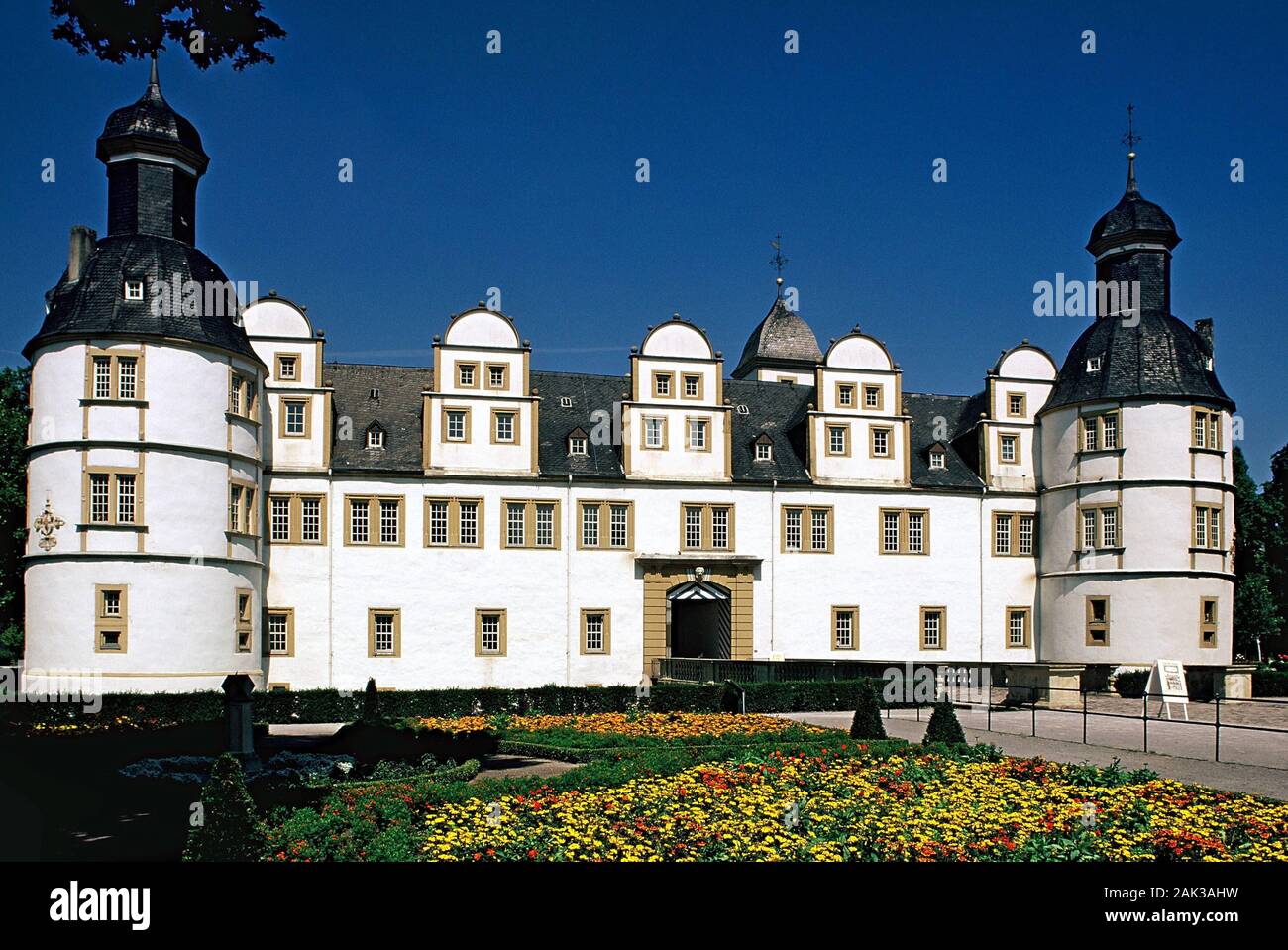 View of the white facade of Neuhaus Castle in Paderborn. The moated ...