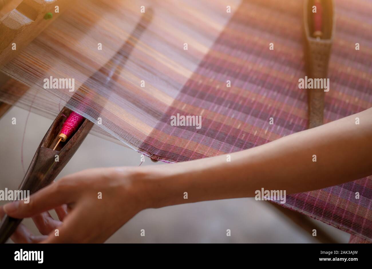 Woman working on weaving machine for weave handmade fabric. Textile ...