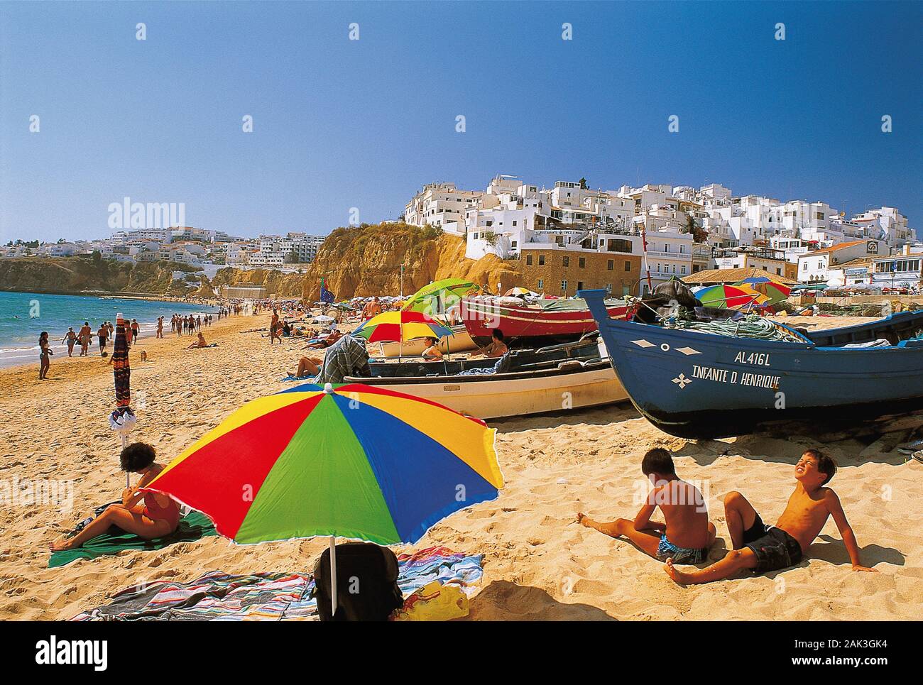 Visitors on the beach of Albufeira at the Algarve. The town Albufeira ...