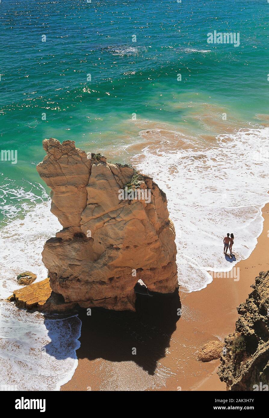 A rock formed by wind and water on the beach Praia da Rocha in South ...