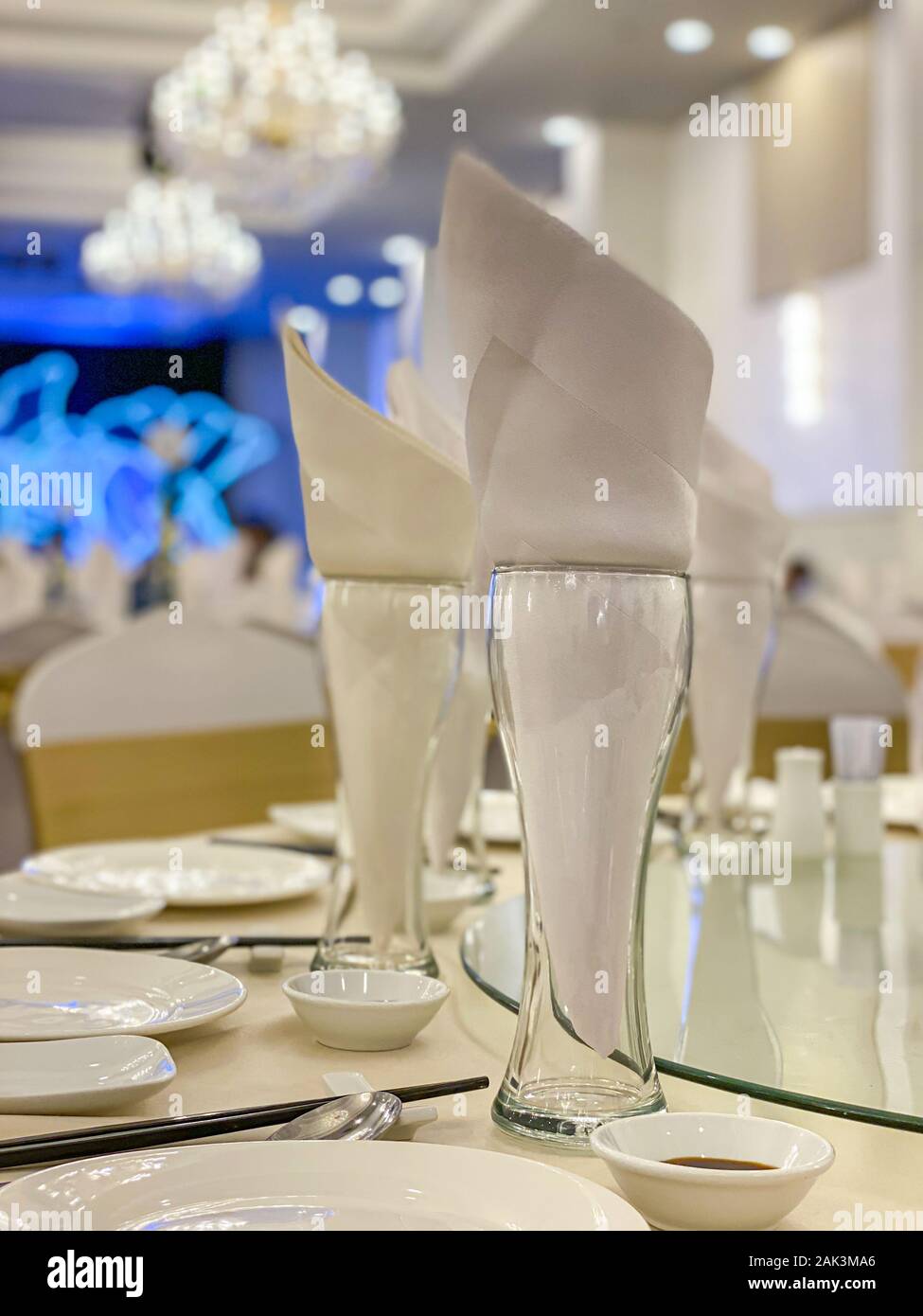Closeup photo of elegant banquet table setting in wedding hall Stock Photo - Alamy