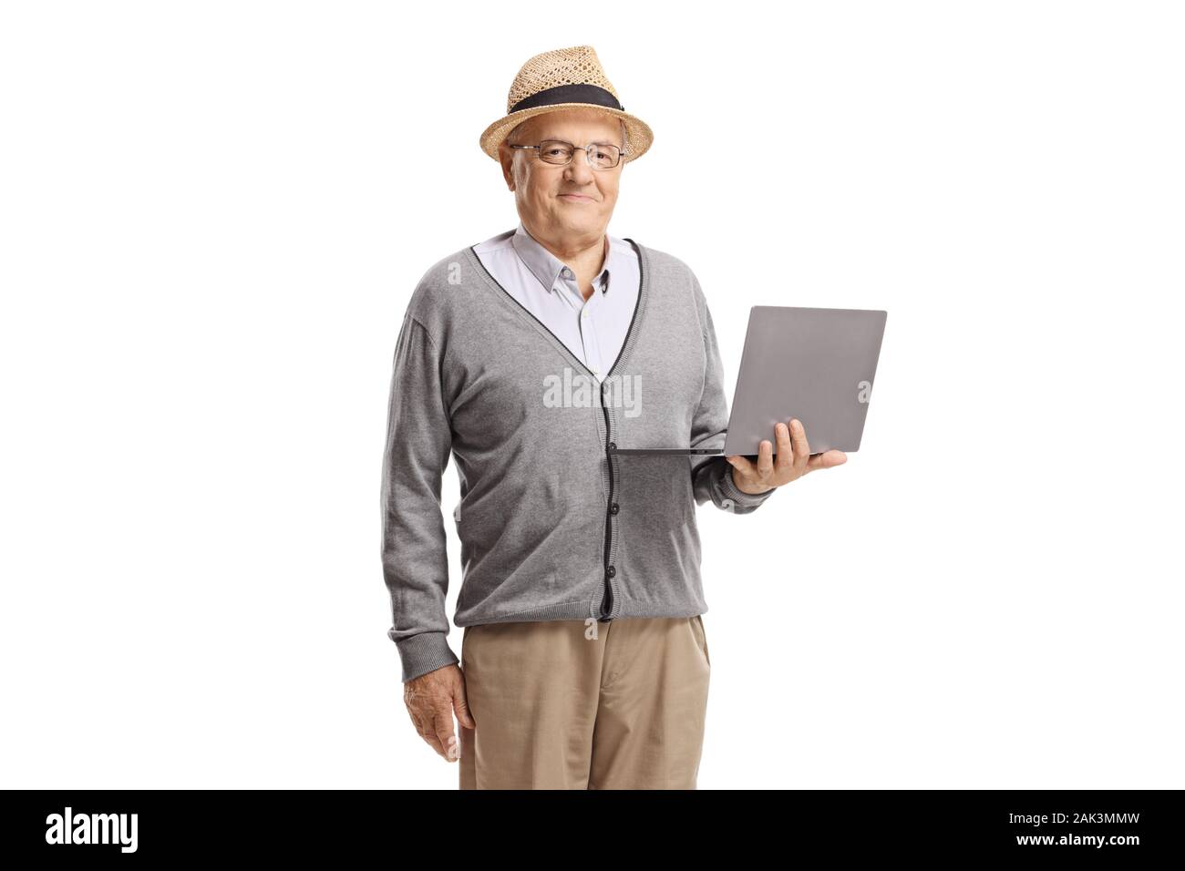 Full length portrait of a senior gentleman standing with a laptop ...