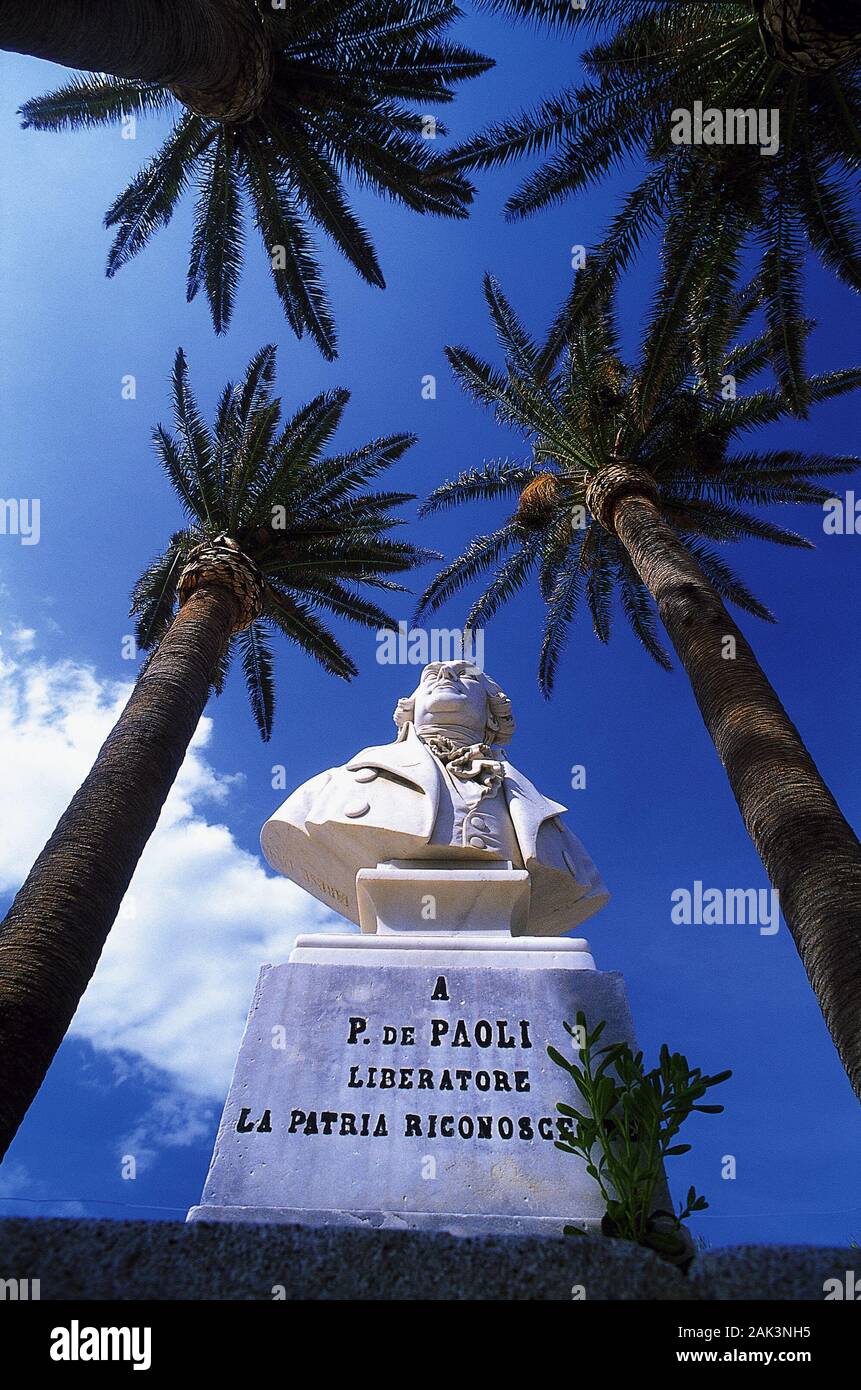 A bust of Pasquale de Paoli stands surrounded by palm trees on the ...