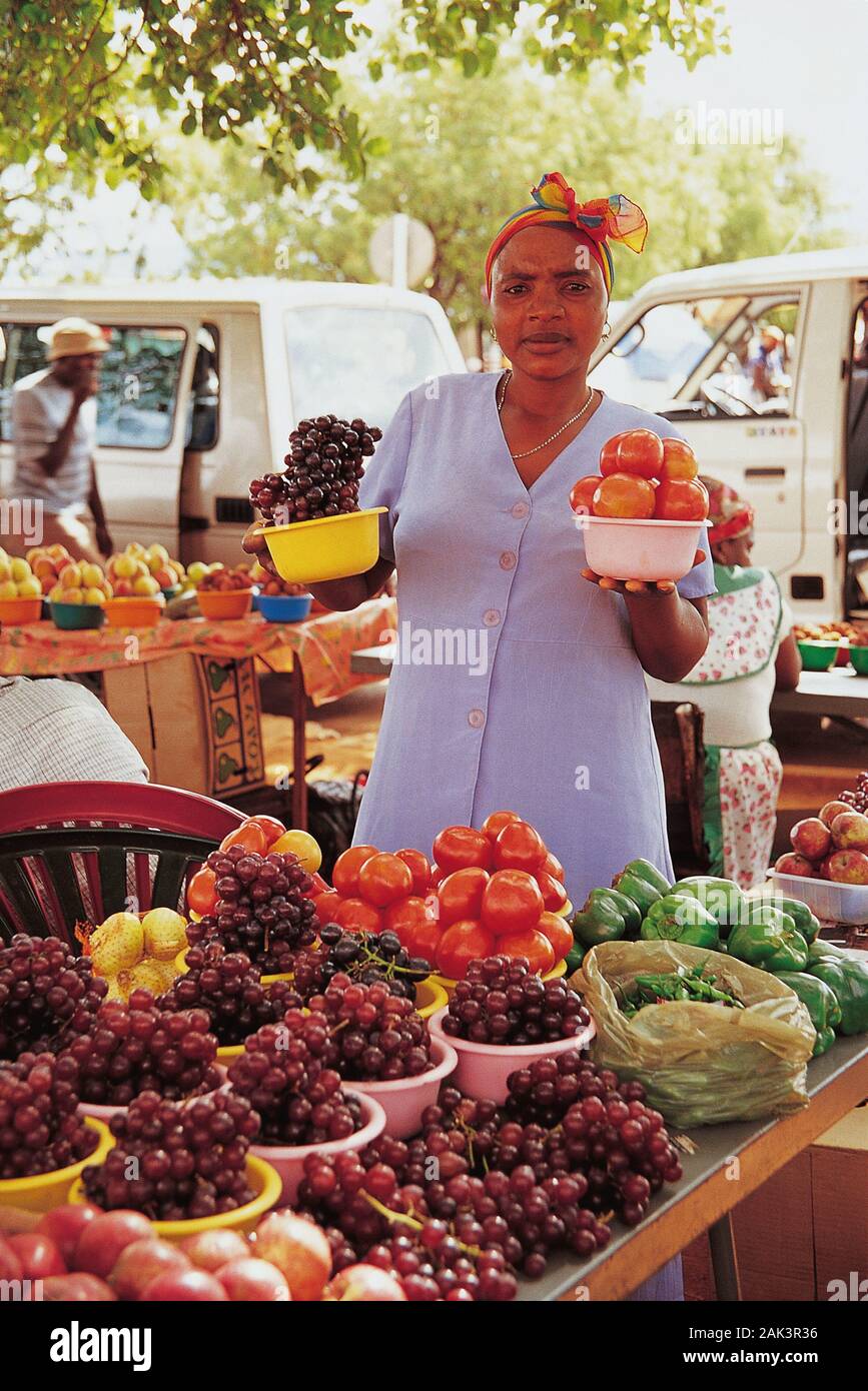 A Woman With Fruits In The Hands At The Weekly Market In Thohoyandou
