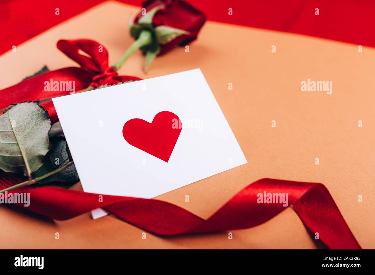 Red rose with message card Stock Photo - Alamy