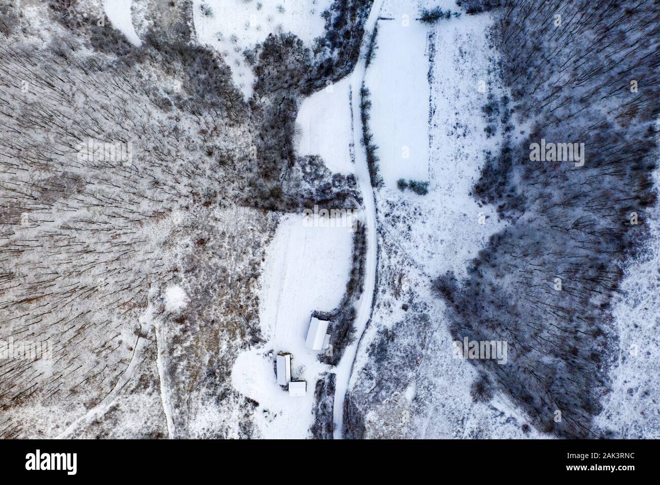 Country road in the snow - drone view Stock Photo - Alamy