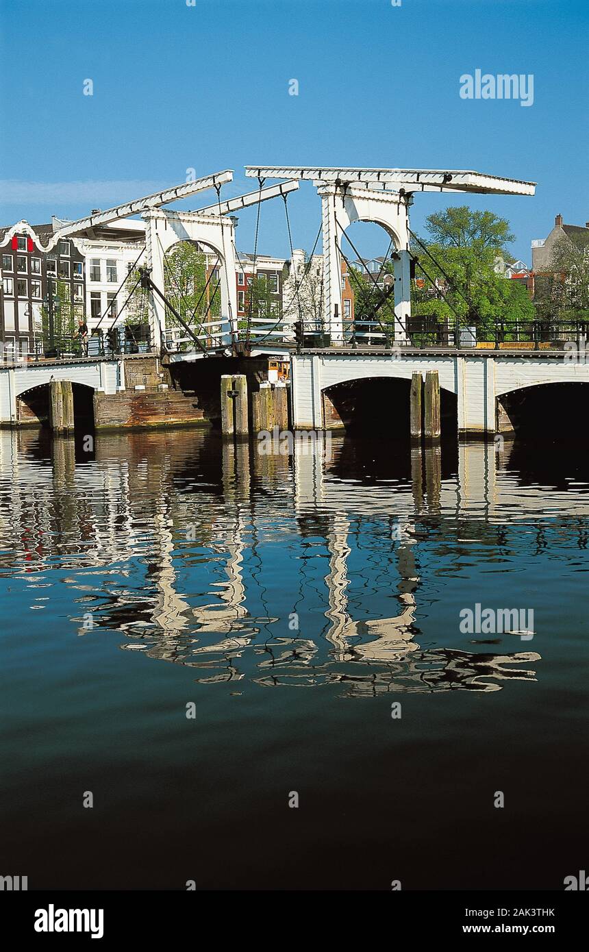 View of the drawbridge Magere Brug across the Amstel in Amsterdam. The ...